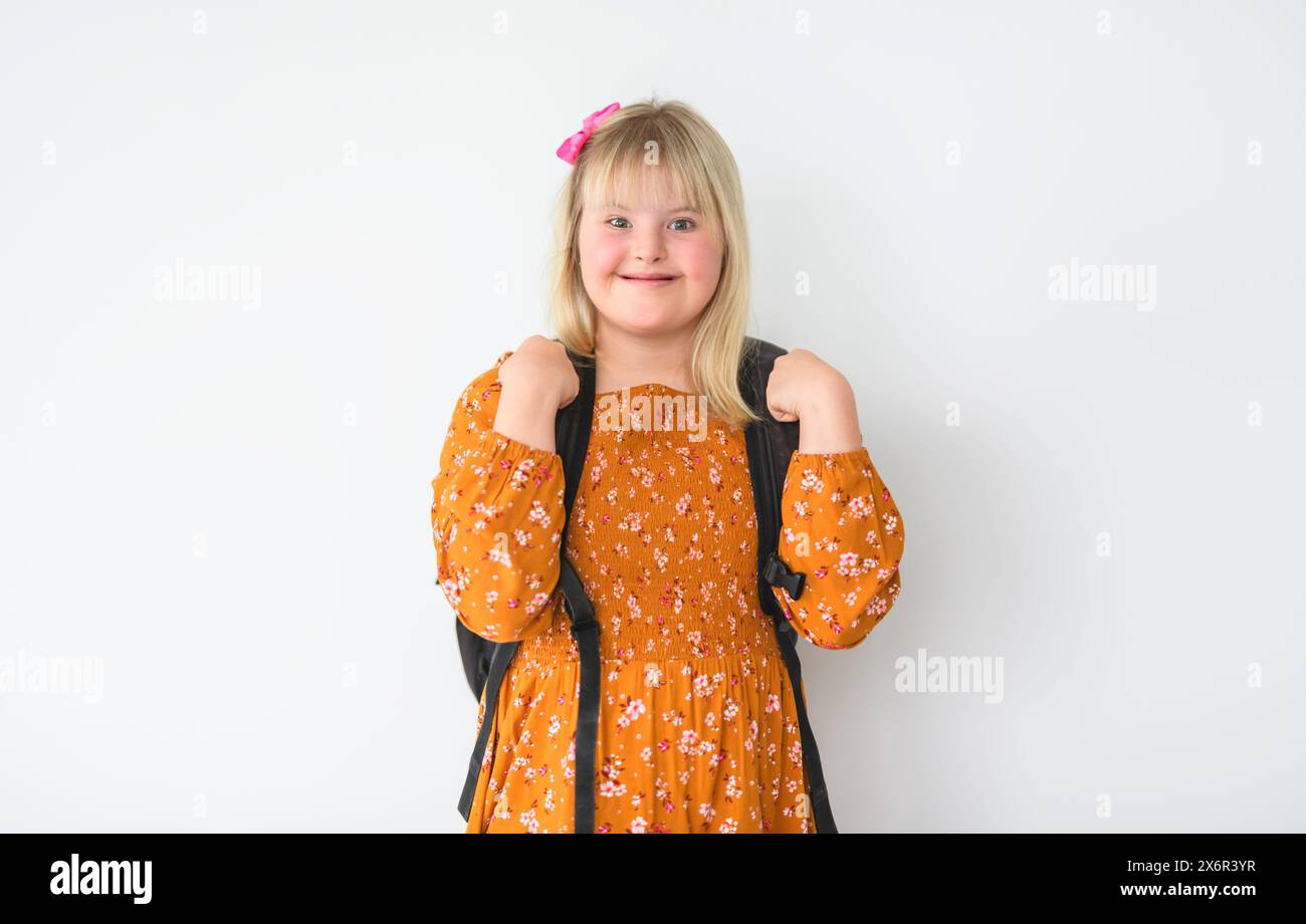 Woman with down syndrome wearing student backpack Stock Photo - Alamy
