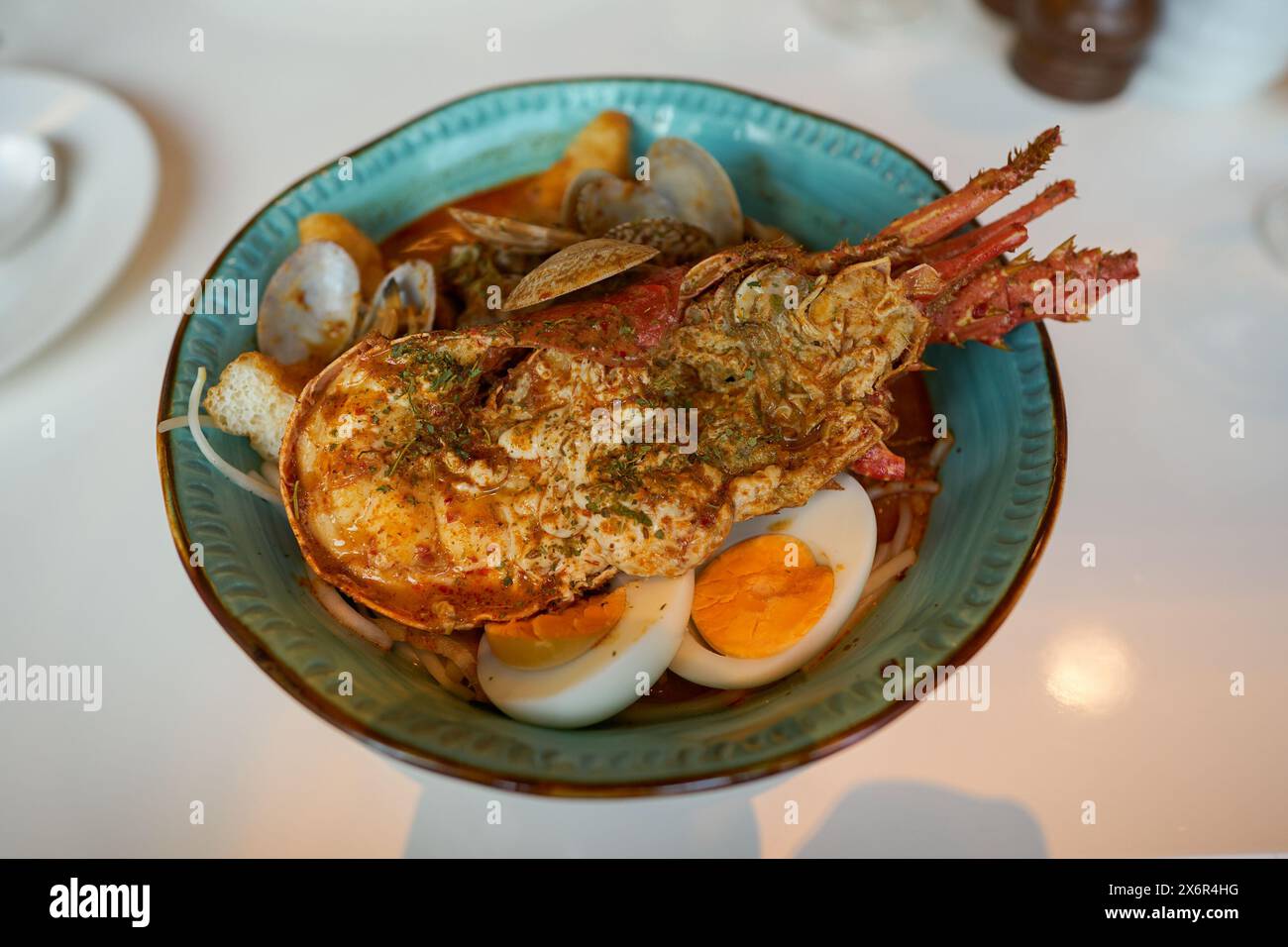 SINGAPORE - NOVEMBER 05, 2023: close up shot of laksa served at Royale ...