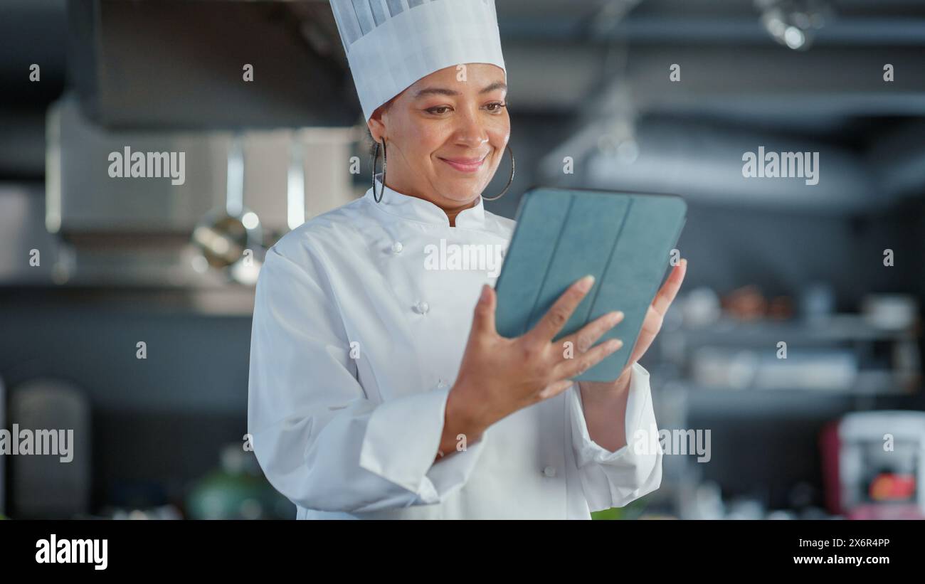 Restaurant Kitchen: Black Female Chef Cooking Delicious and Authentic ...