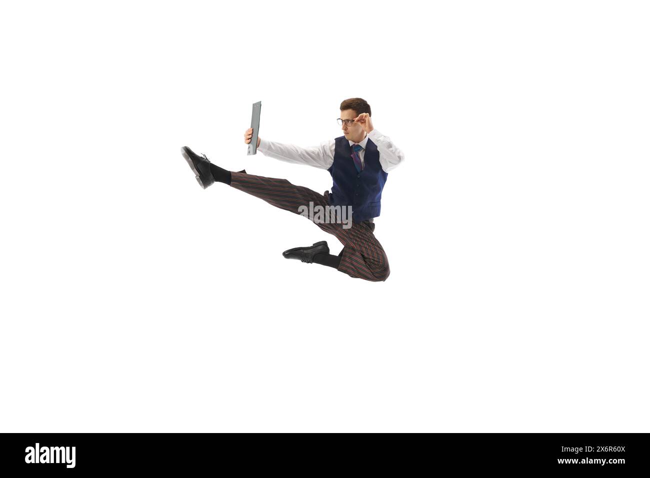 Focused and concentrated man, employee in formal wear, in mid-air pose ...