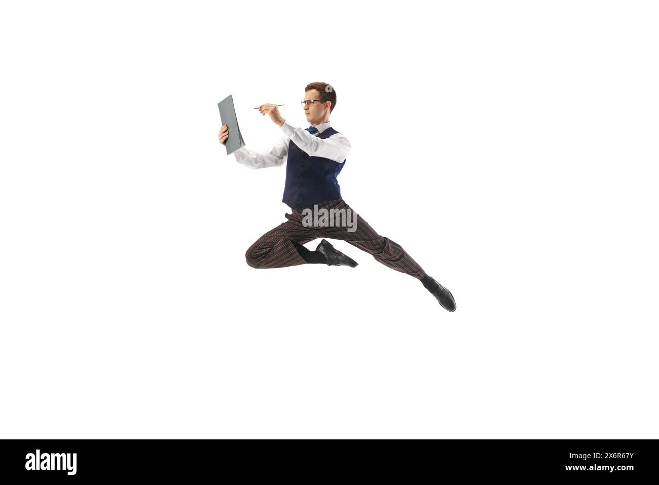 Focused and concentrated man, employee in formal wear, in mid-air pose ...
