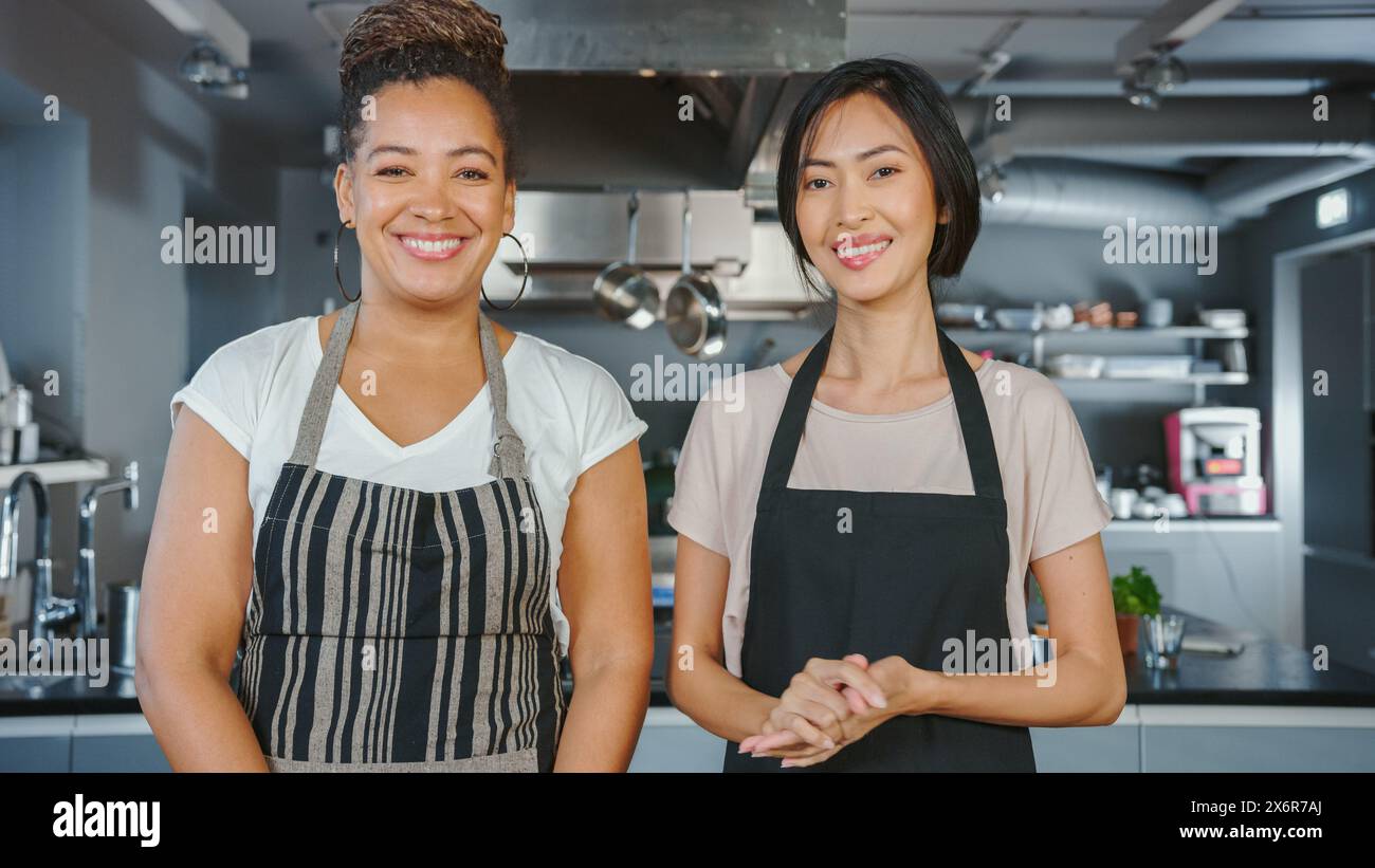 TV Cooking Show Kitchen with Two Master Chefs. Asian and Black Female ...