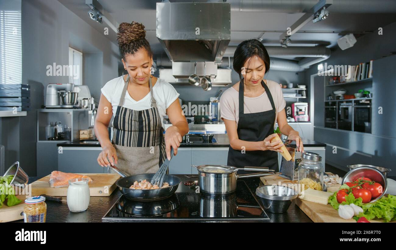 TV Cooking Show Kitchen with Two Master Chefs. Two Female Presenters ...