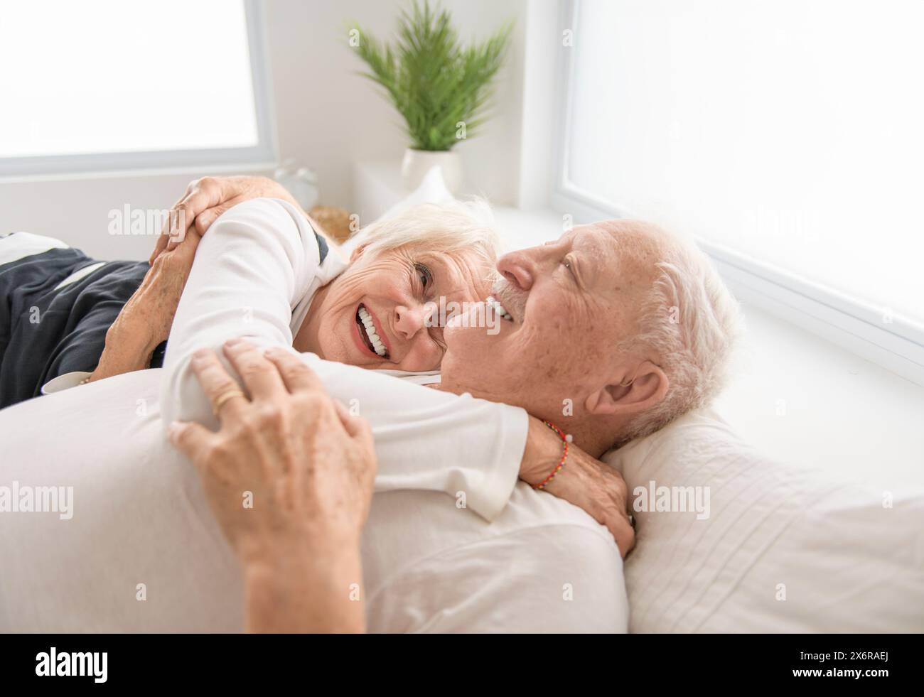 Senior 80 years old Couple Relaxing In Bed together Stock Photo - Alamy