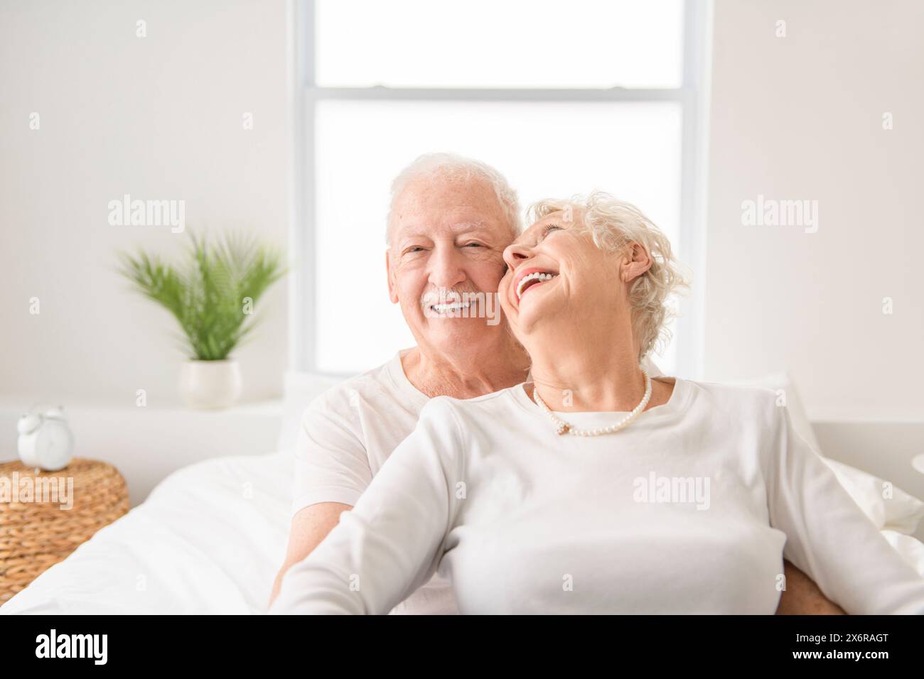 Senior 80 years old Couple Relaxing In Bed together Stock Photo - Alamy