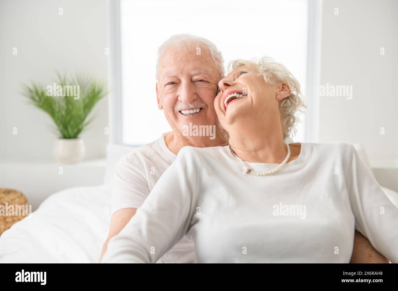 Senior 80 years old Couple Relaxing In Bed together Stock Photo - Alamy