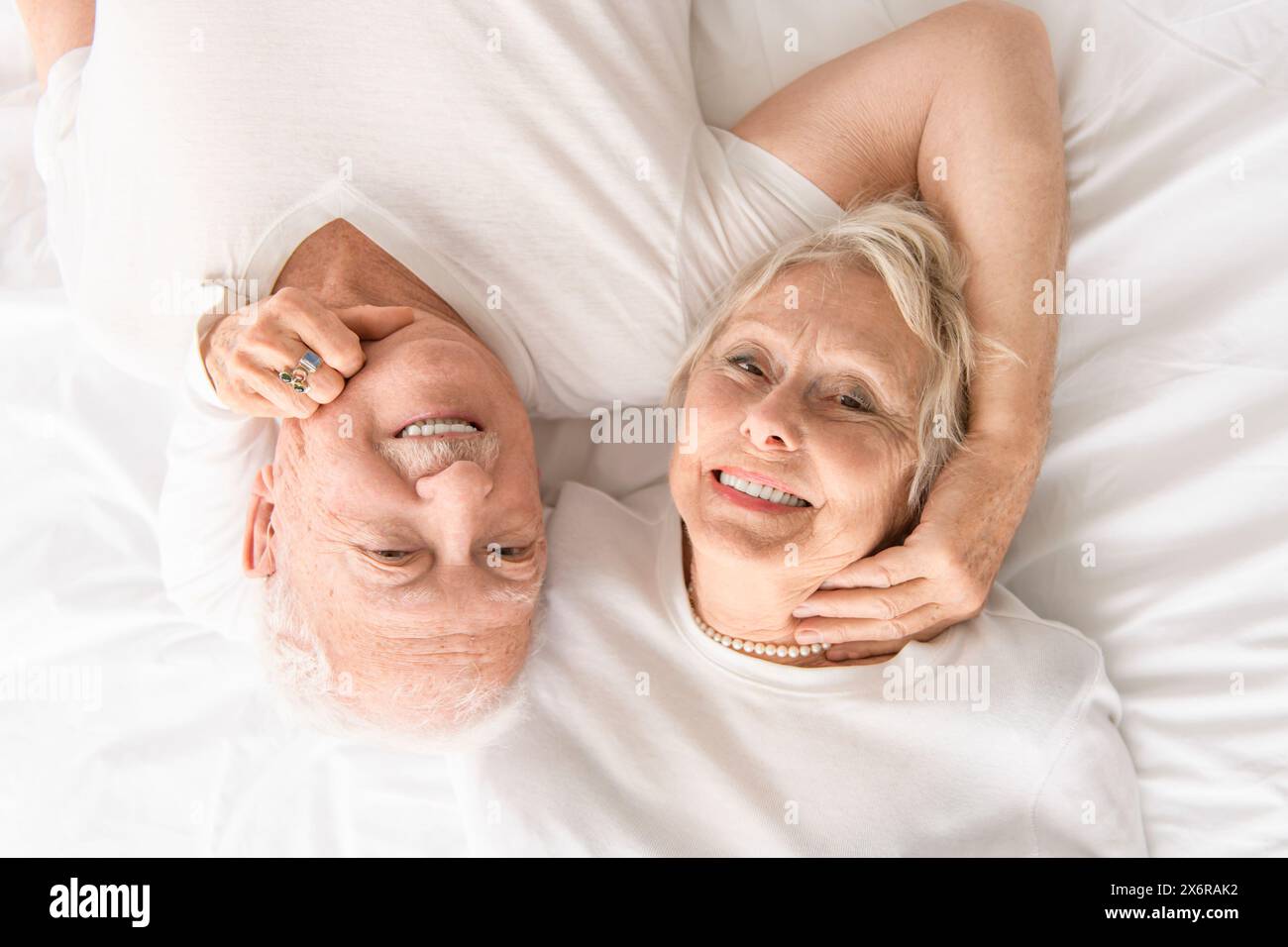 Senior 80 years old Couple Relaxing In Bed together Stock Photo - Alamy
