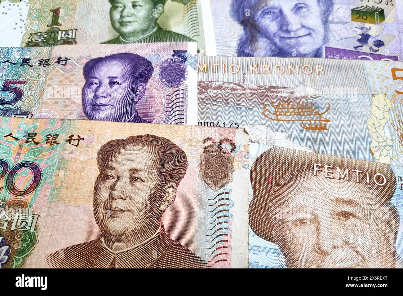 Close-up on a stack of Chinese Remninbi and Swedish Krona Stock Photo ...