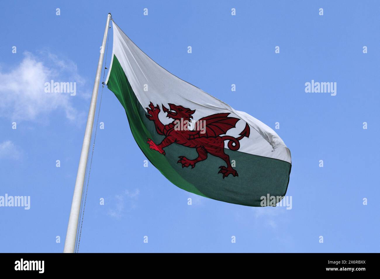 Flag of Wales waving atop of its pole Stock Photo - Alamy