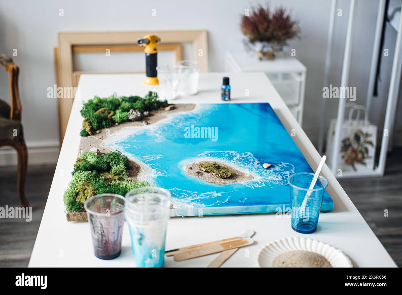 Epoxy Resin Art Depicting a Coastal Landscape on Studio Table Stock ...