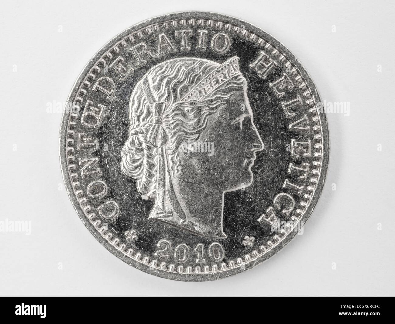 Close-up of a swiss 20 cents coin, white background, back side Stock ...