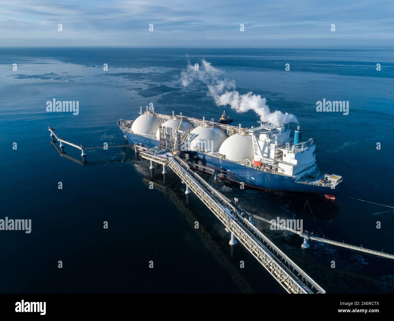 Large lng tanker docked at industrial port terminal for cargo ...