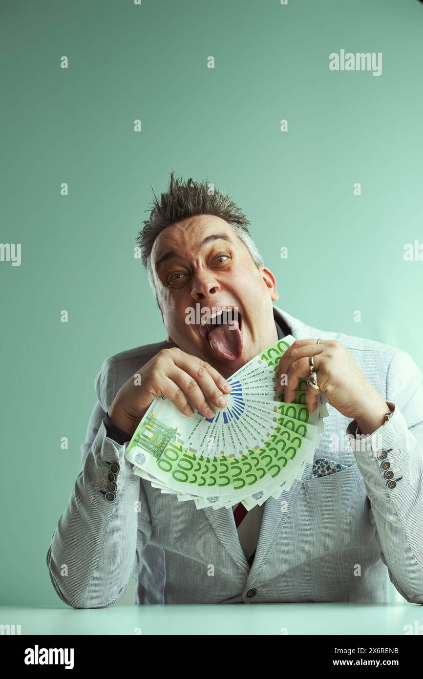 Charismatic scammer in a suit displays cash to lure unsuspecting ...