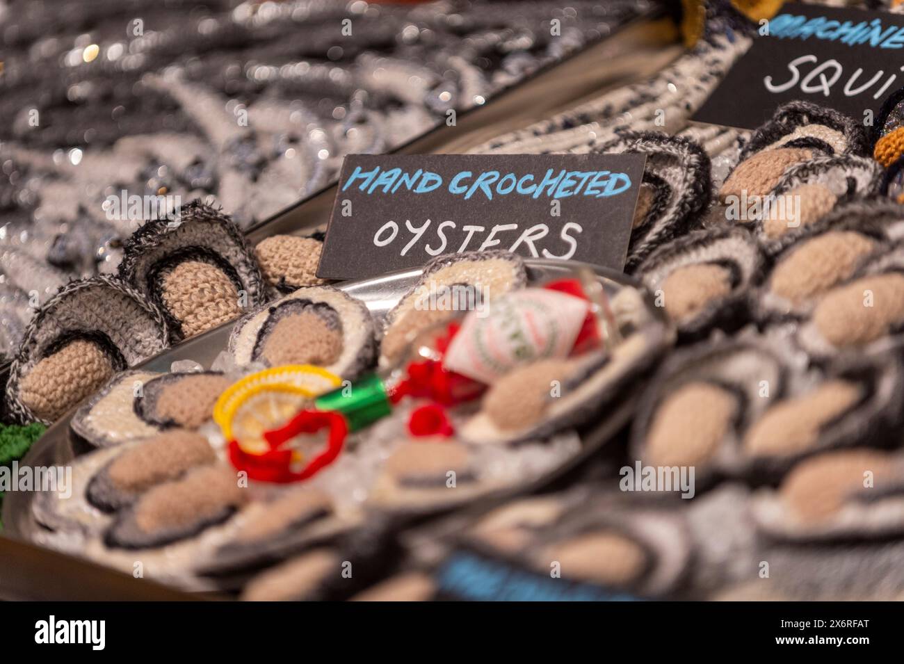 London, UK. 16 May 2024. Detail of the counter comprising knitted fish ...