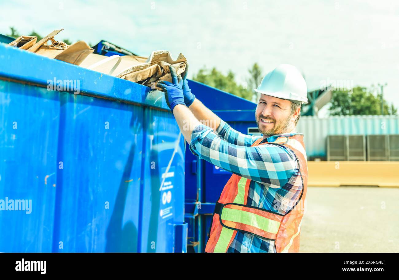 worker who recycling cardboard on recycle center Stock Photo - Alamy