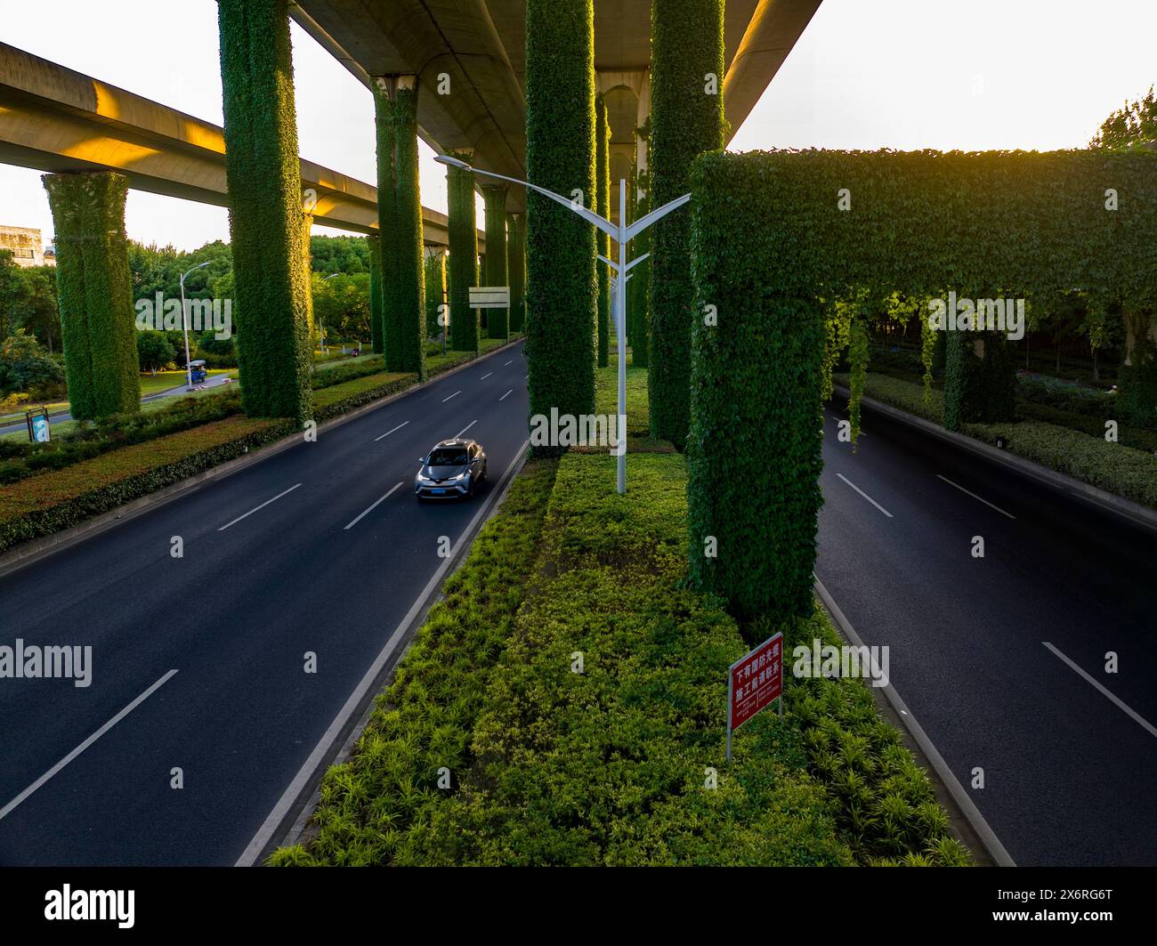 KUNSHAN, CHINA - MAY 16, 2024 - Cars drive on an elevated road with ...