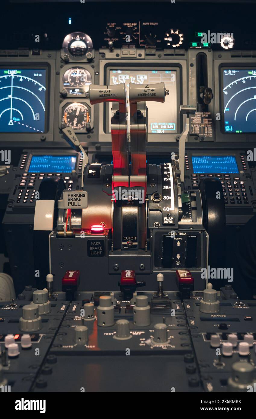 Cockpit view of an airplane during a night-time flight with illuminated ...