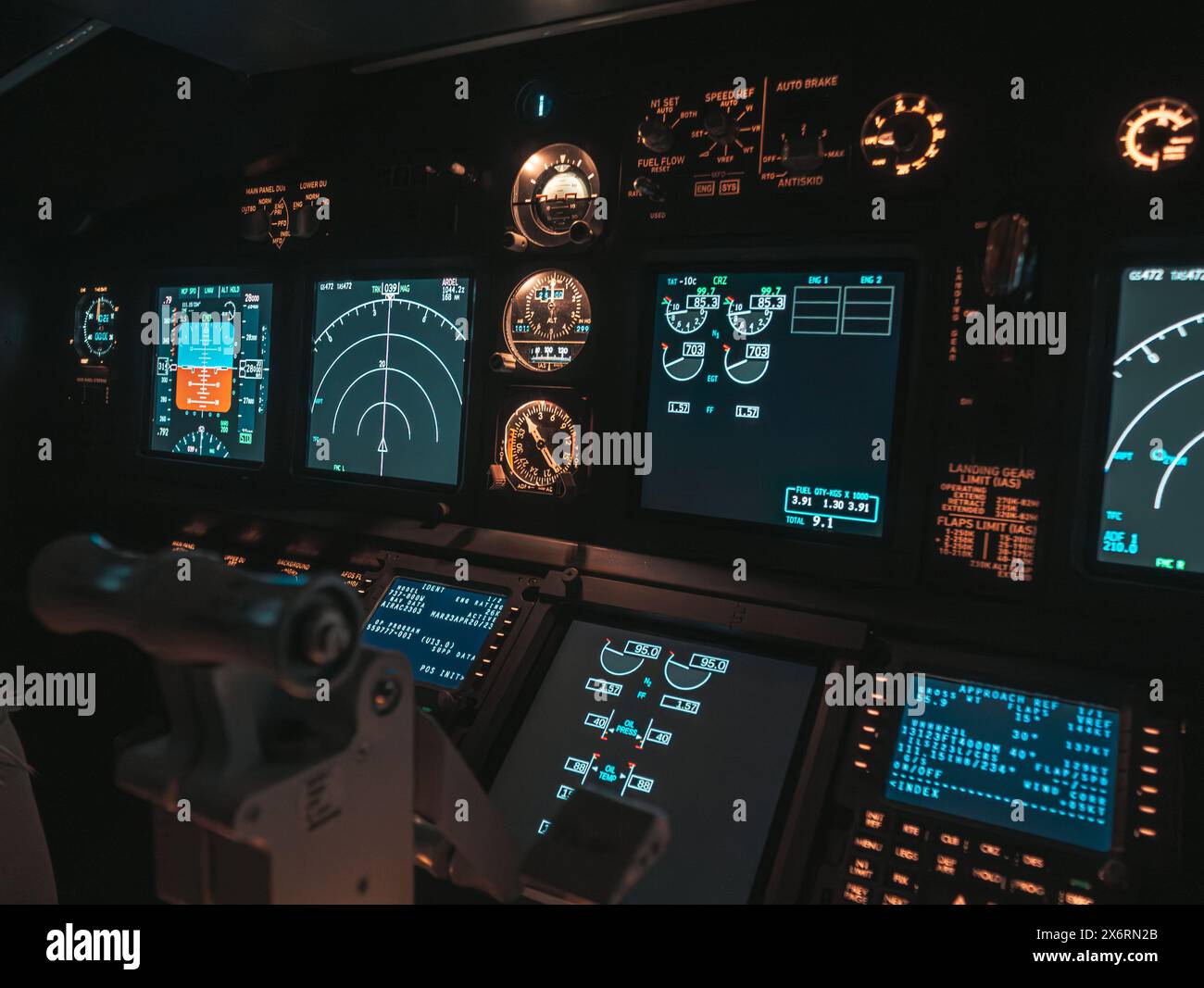 Cockpit view of an airplane during a night-time flight with illuminated ...