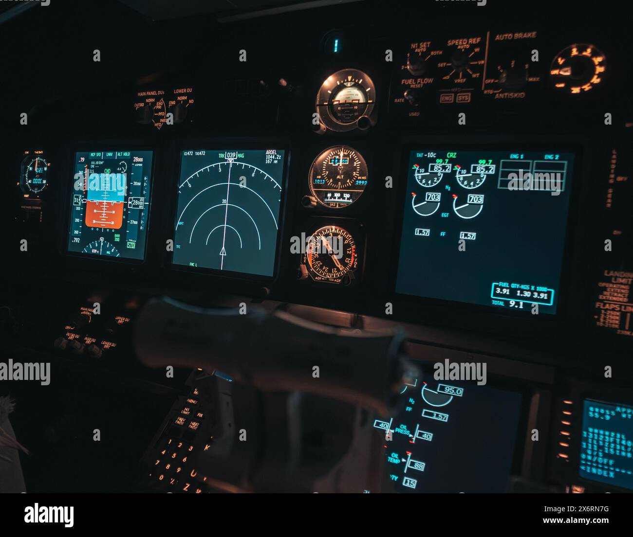 Cockpit view of an airplane during a night-time flight with illuminated ...