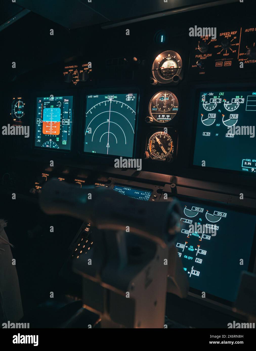 Cockpit view of an airplane during a night-time flight with illuminated ...