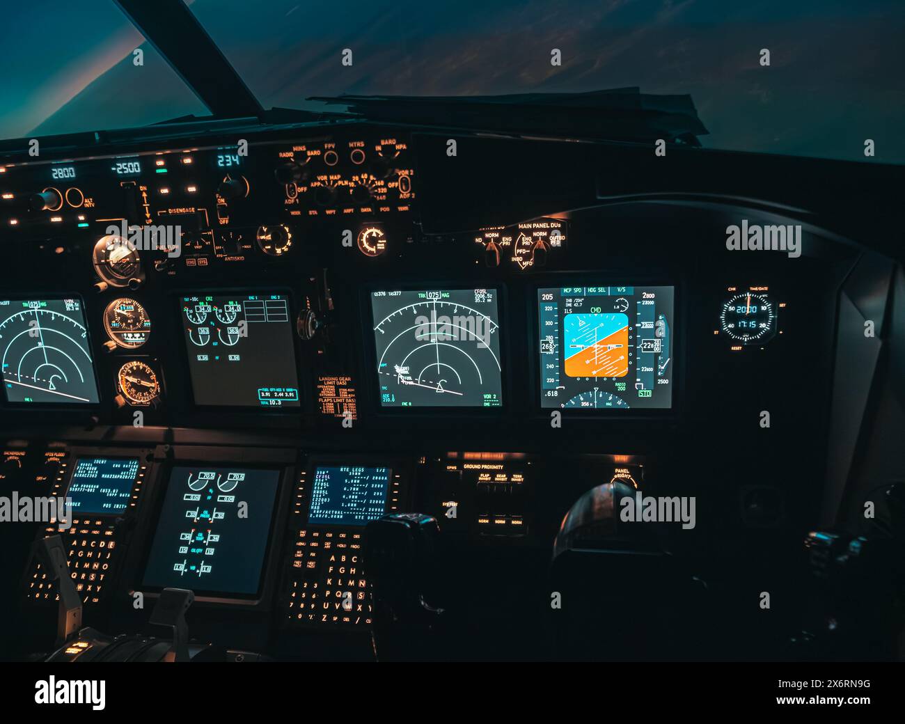 Cockpit view of an airplane during a night-time flight with illuminated ...