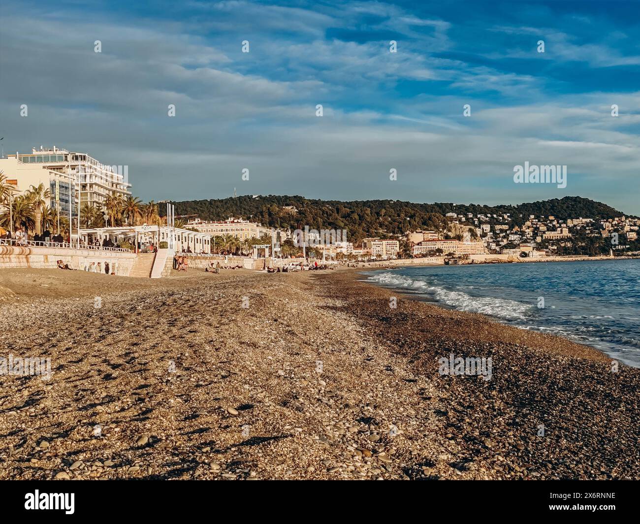 Sunset on the beach in Nice, on the French Riviera Stock Photo - Alamy
