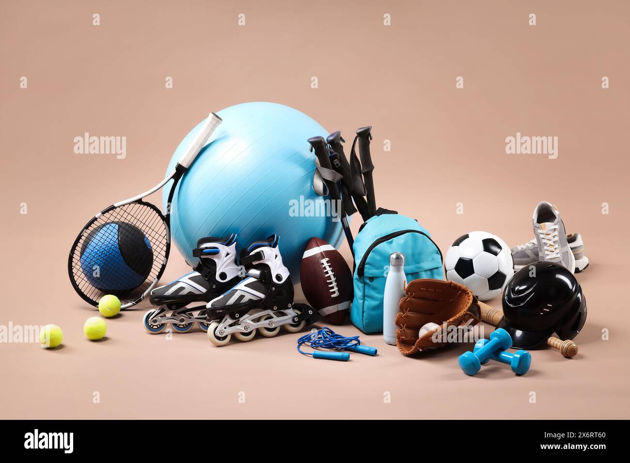 Many different sports equipment on beige background Stock Photo - Alamy