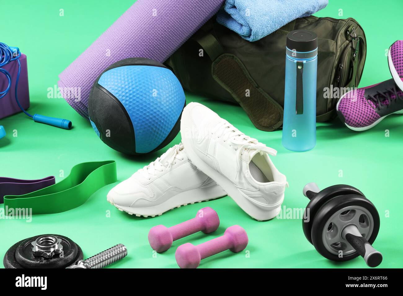 Many different sports equipment on green background Stock Photo - Alamy