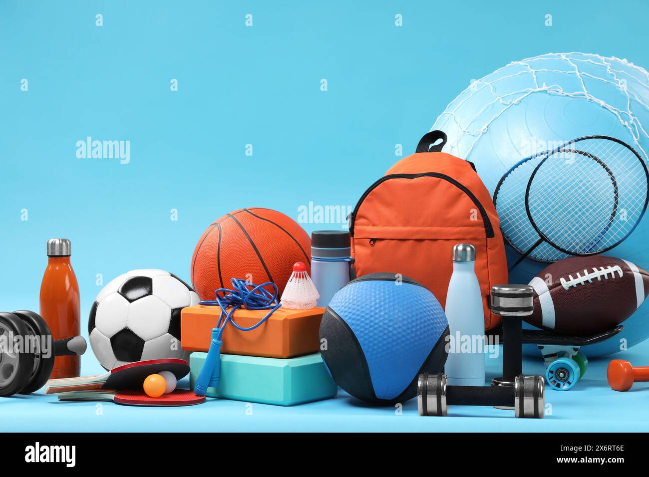 Many different sports equipment on light blue background Stock Photo ...