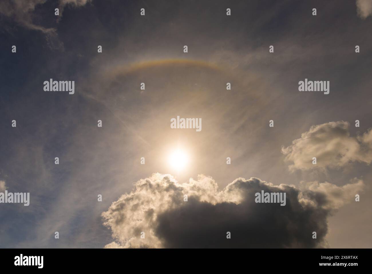 Circumhorizontal arc formed by refraction by the ice crystals in the ...
