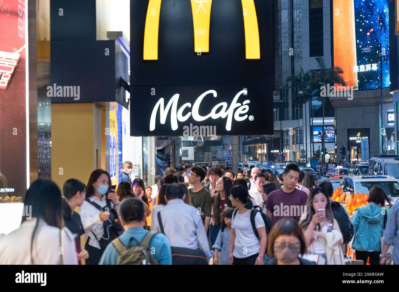 Pedestrians walk past the American multinational fast-food hamburger ...