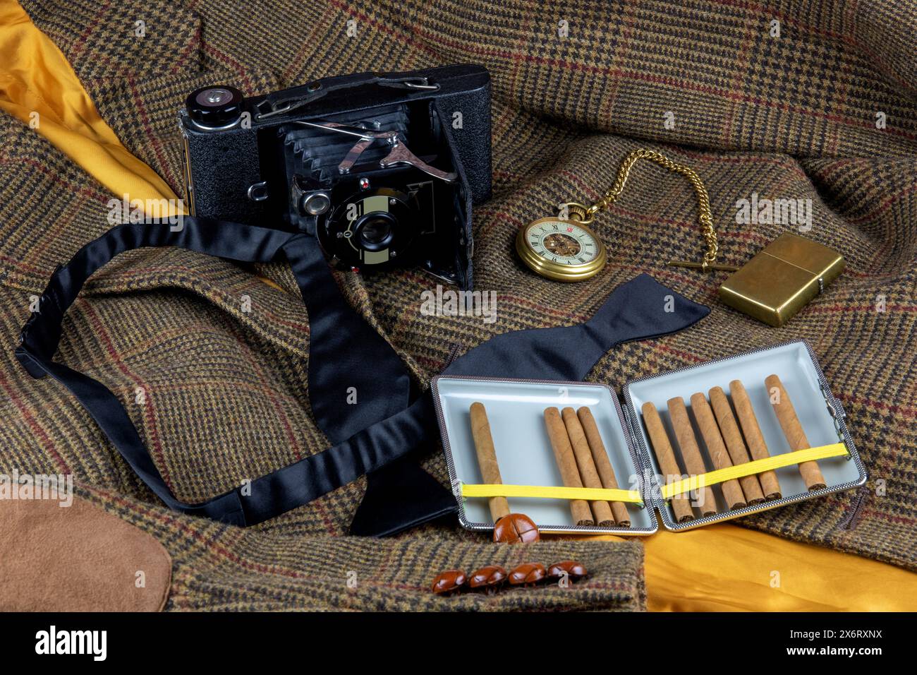 Tweed jacket with vintage camera pocket watch cigar case and brass ...