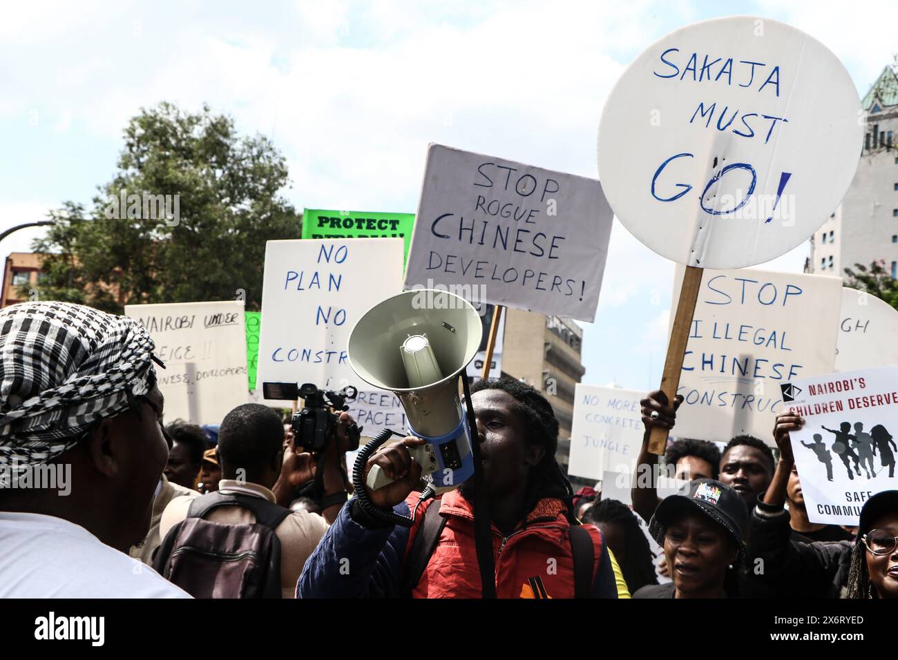 Nairobi, Kenya. 16th May, 2024. Residents of Nairobi hold placards and ...