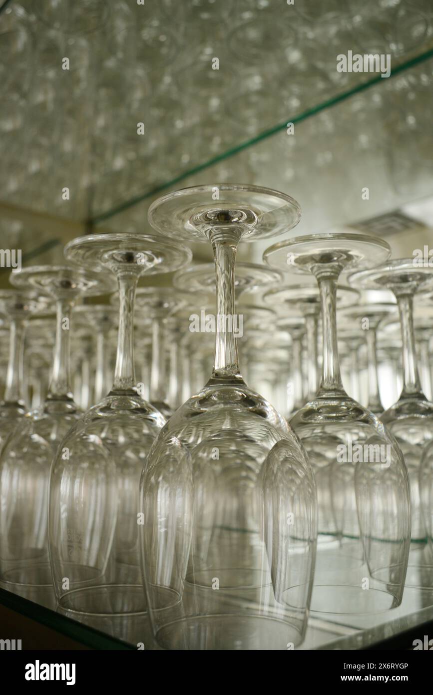 Vine glasses inside a shelf gastro symbol Stock Photo - Alamy