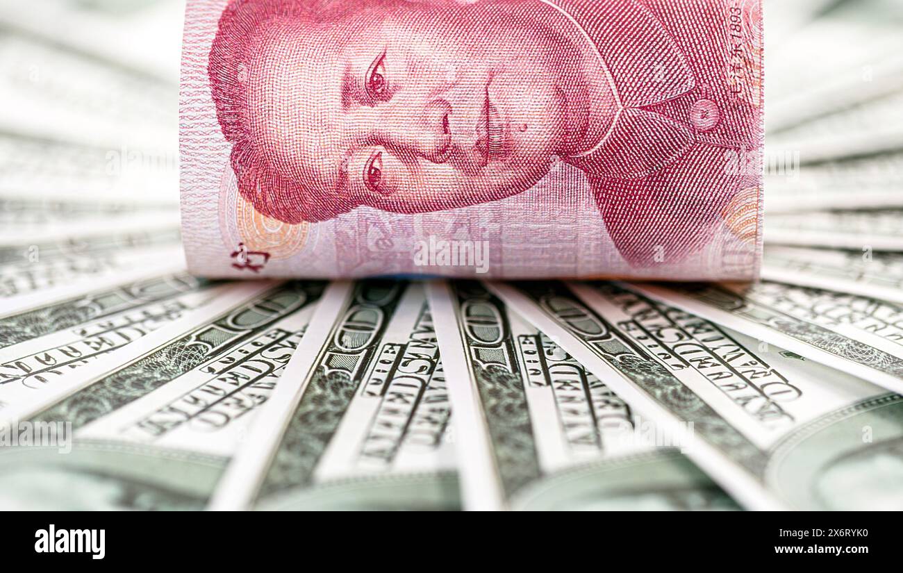 100 dollar banknotes with a hundred yuan note (Renminbi), concept of ...