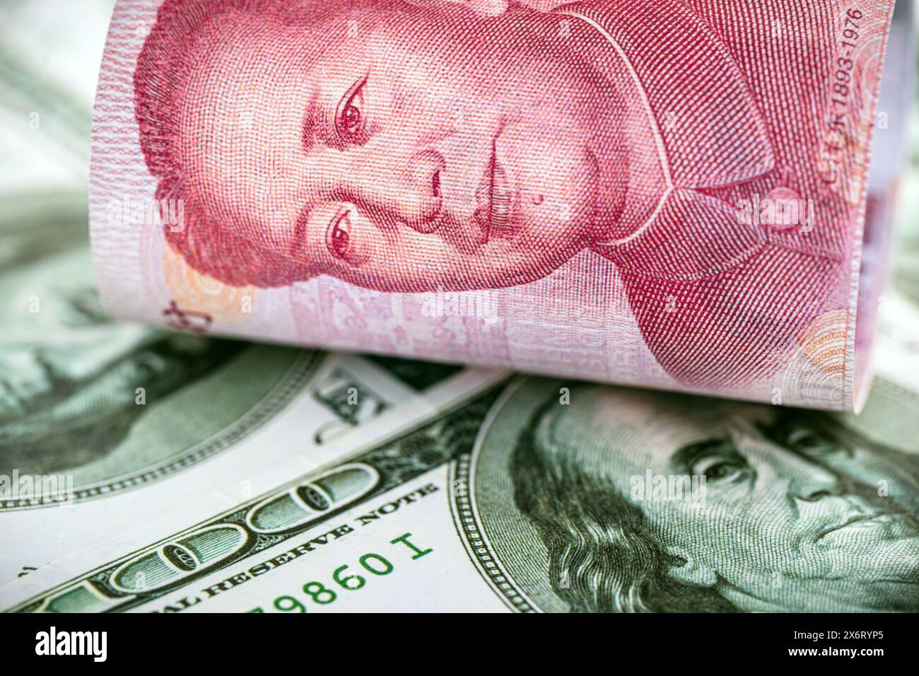 100 dollar banknotes with a hundred yuan note (Renminbi), concept of ...