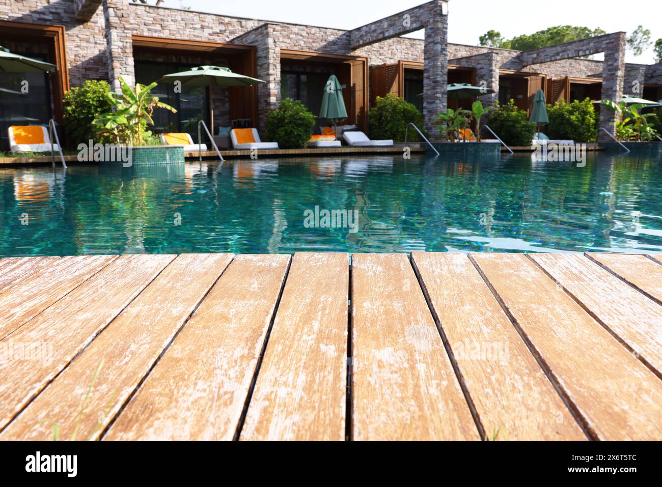 Wooden deck, swimming pool and recreational area at luxury resort Stock ...
