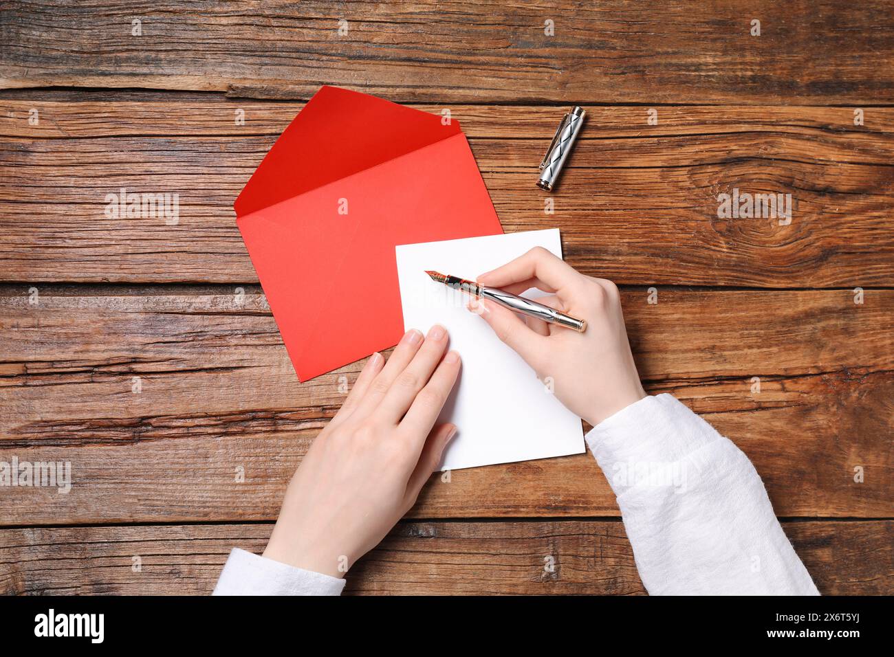 Woman writing letter with envelope hi-res stock photography and images ...