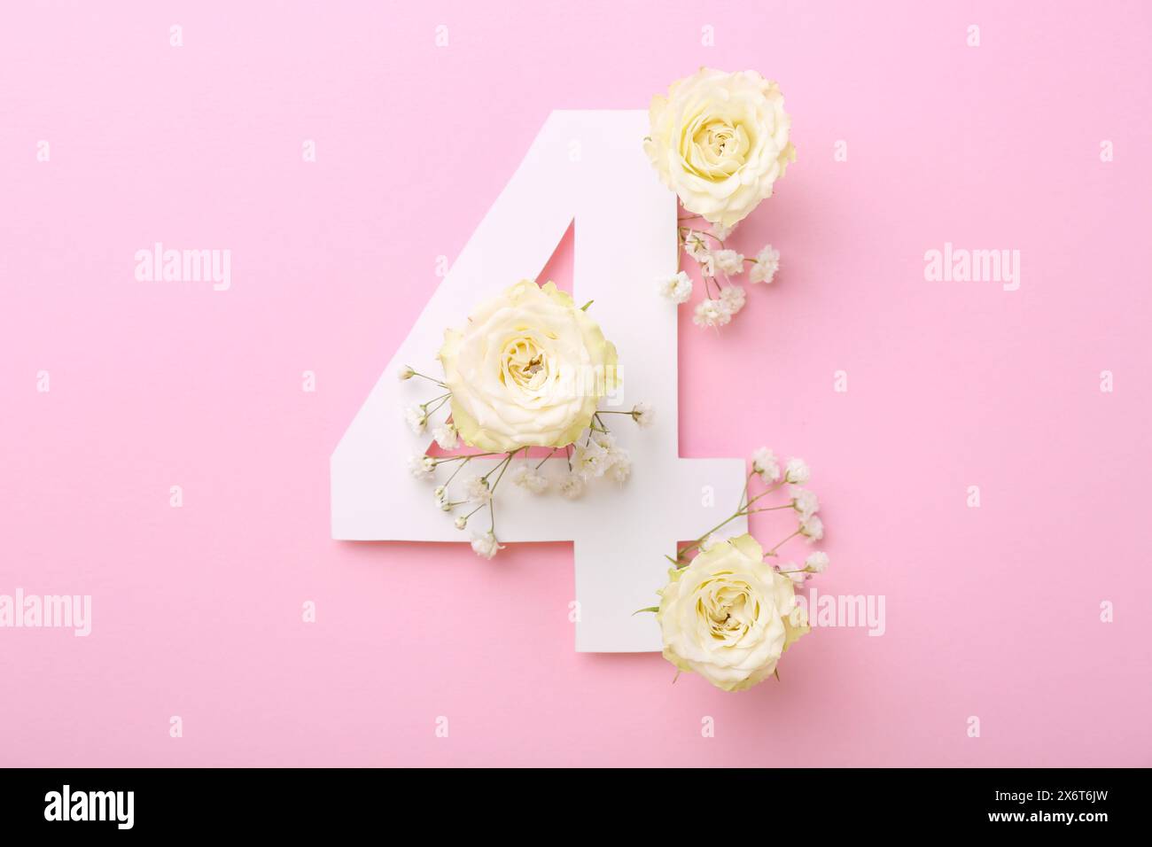 Paper number 4 and beautiful flowers on pink background, top view Stock ...