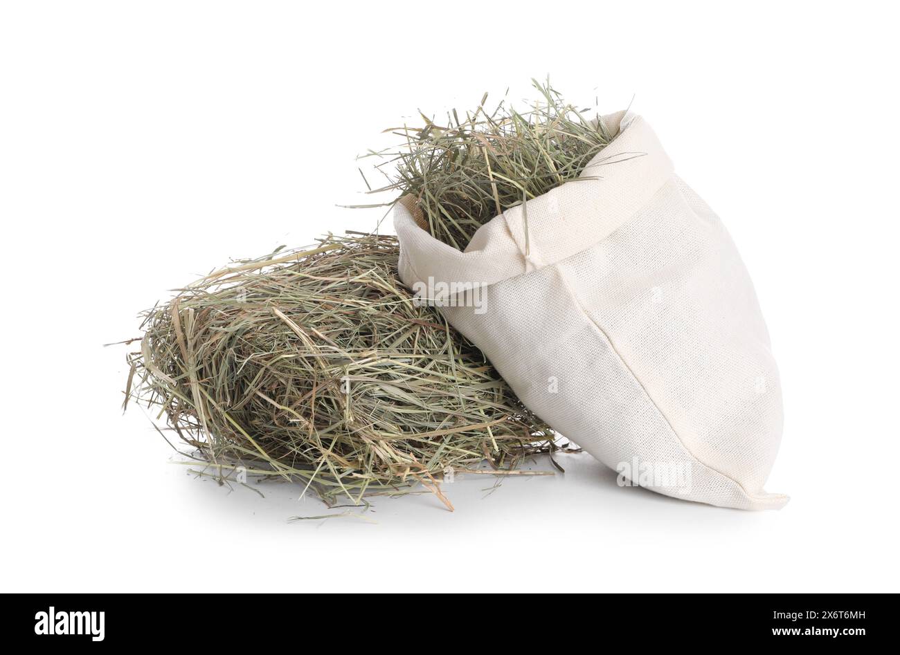 Dried hay in burlap sack isolated on white Stock Photo - Alamy