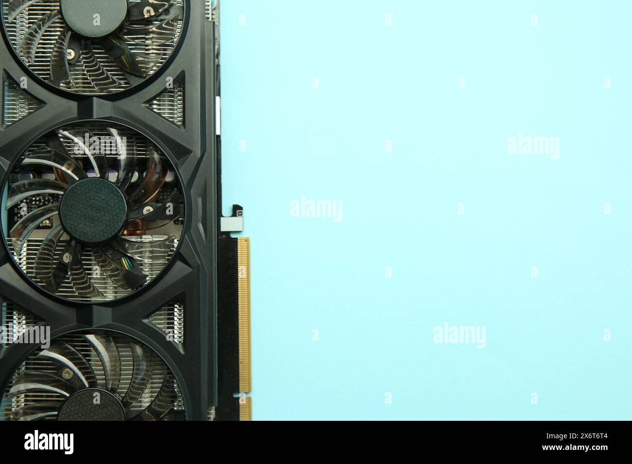 One graphics card on light blue background, top view. Space for text ...