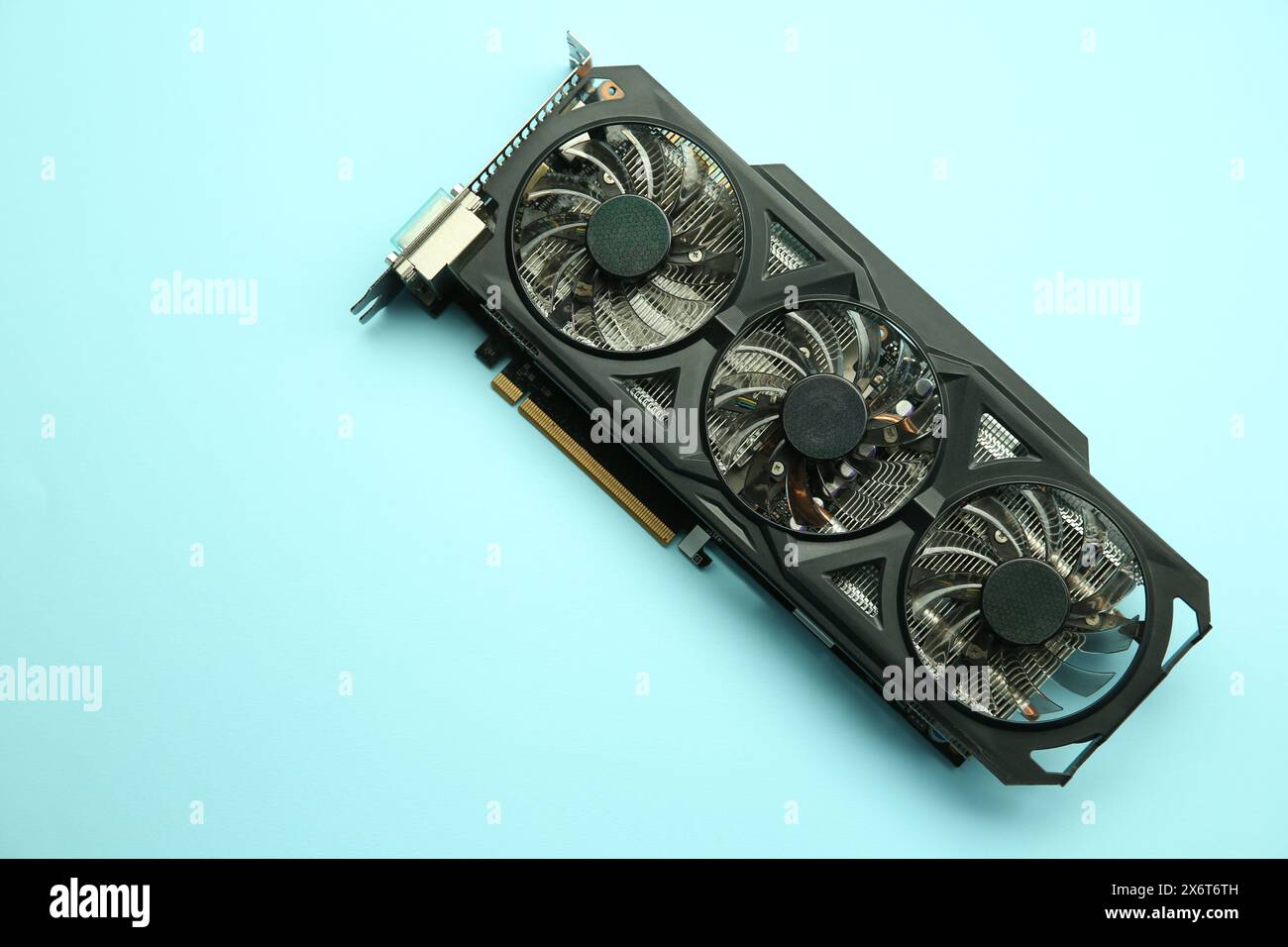 One graphics card on light blue background, top view. Space for text ...