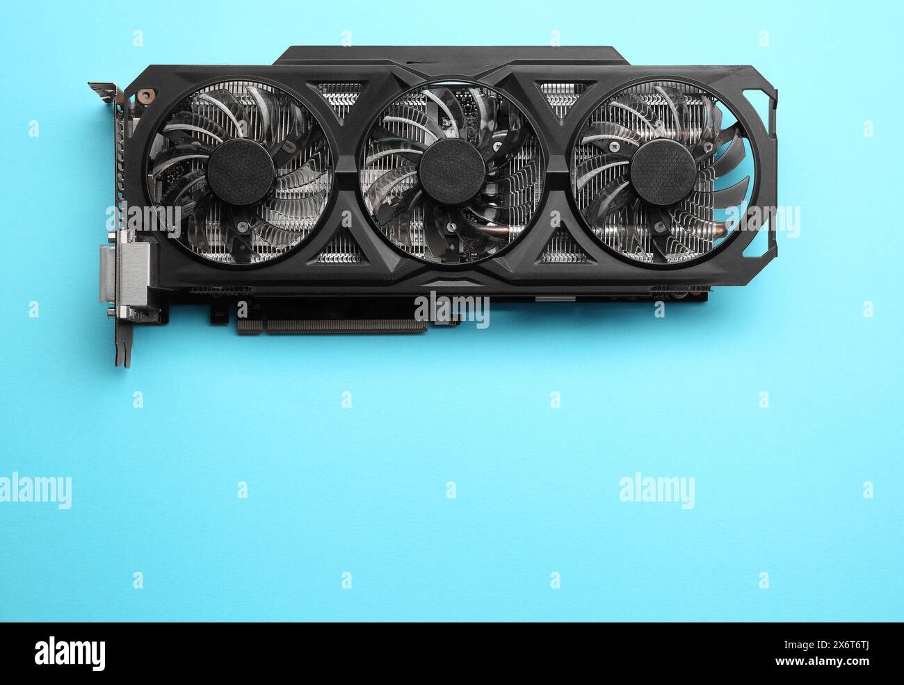 One graphics card on light blue background, top view. Space for text ...