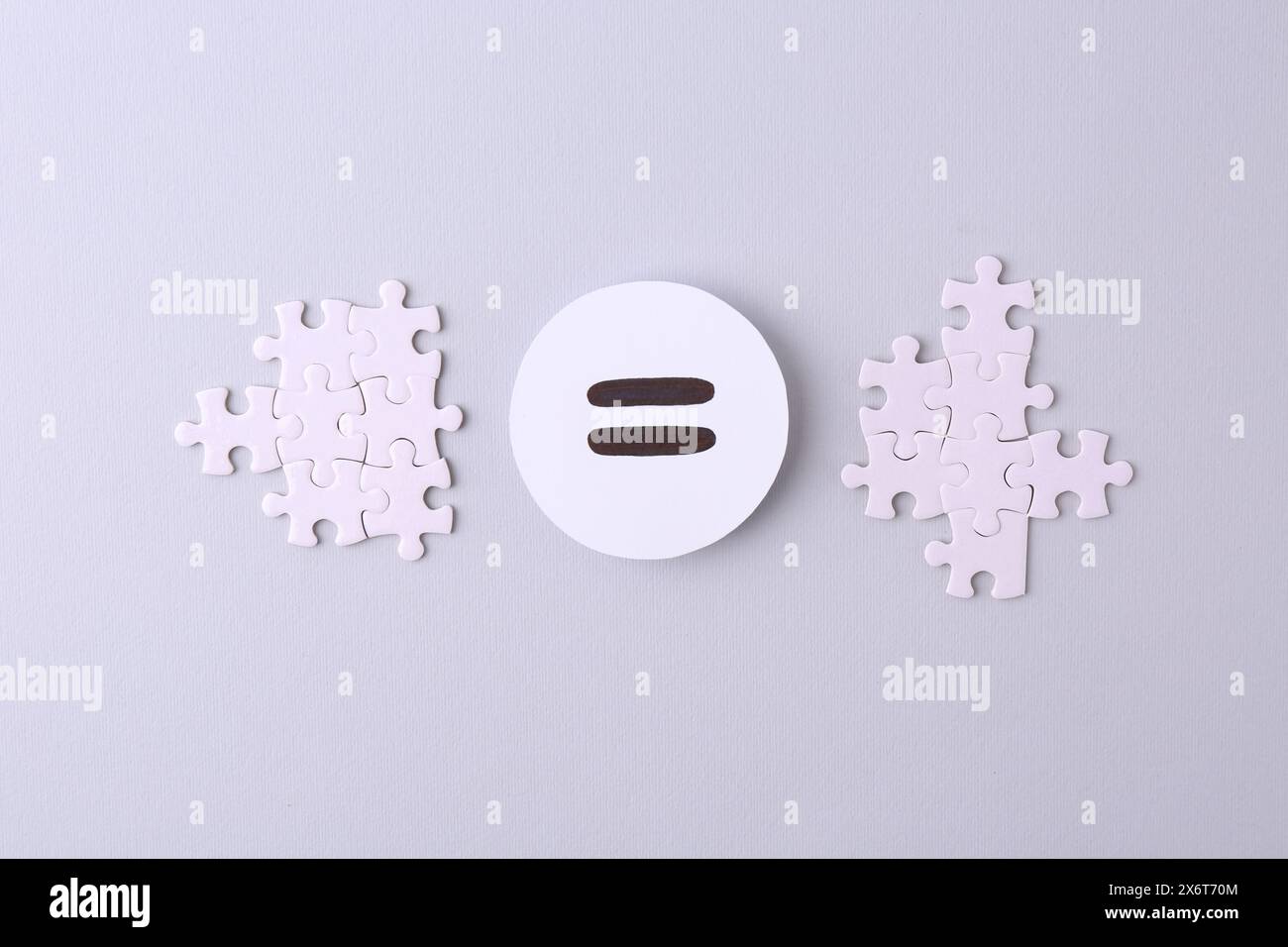 Puzzle pieces and equals sign on light background, flat lay Stock Photo ...
