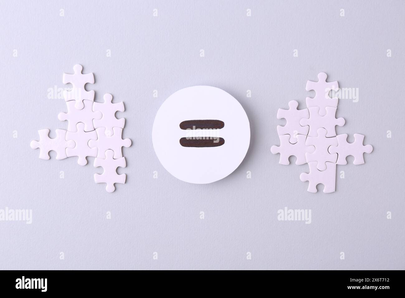 Puzzle pieces and equals sign on light background, flat lay Stock Photo ...