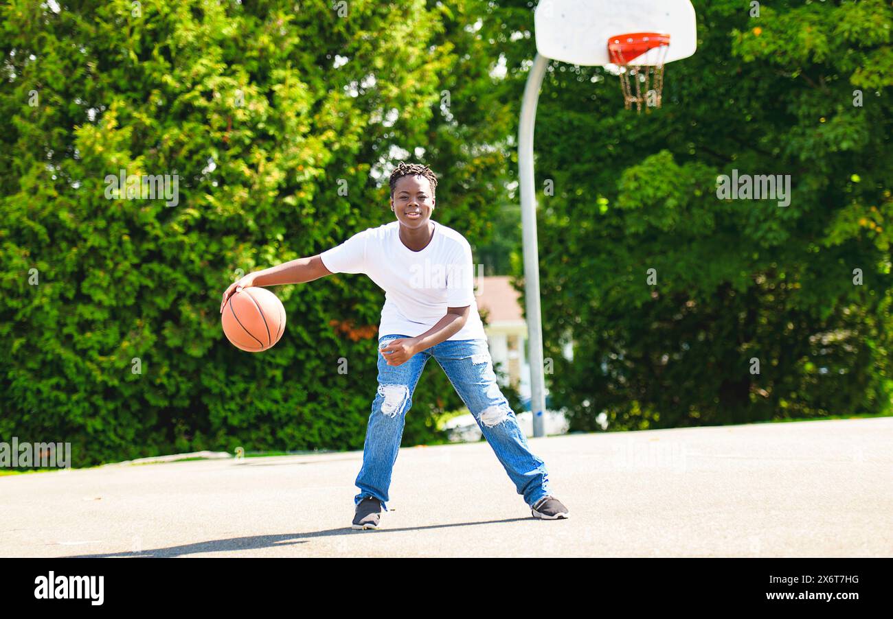 Portrait of american basketball player guy standing at basketball court ...
