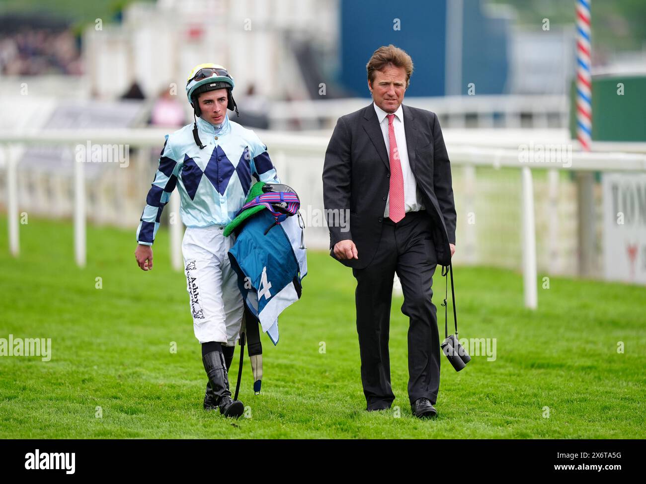 Jockey Rossa Ryan and trainer Ralph Beckett walking back after Whiskey ...