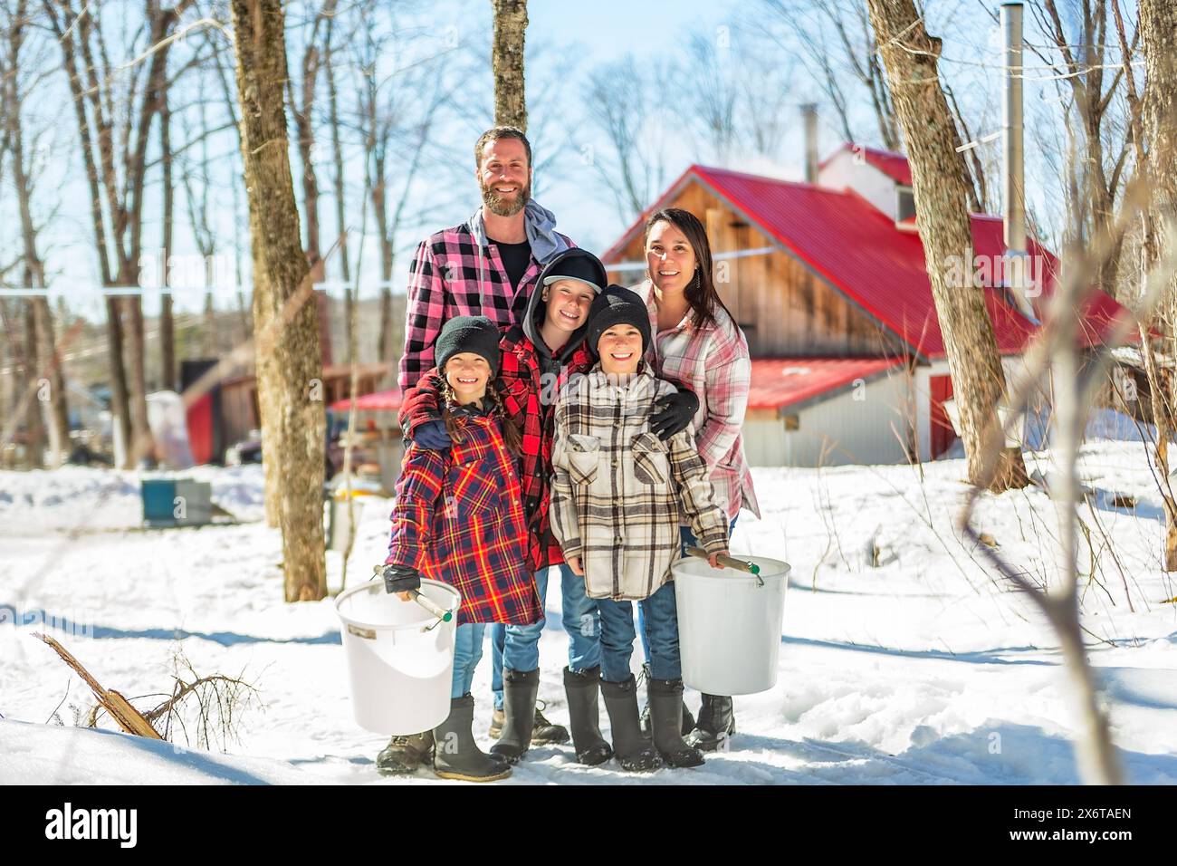 family close to a maple shack having fun together Stock Photo - Alamy