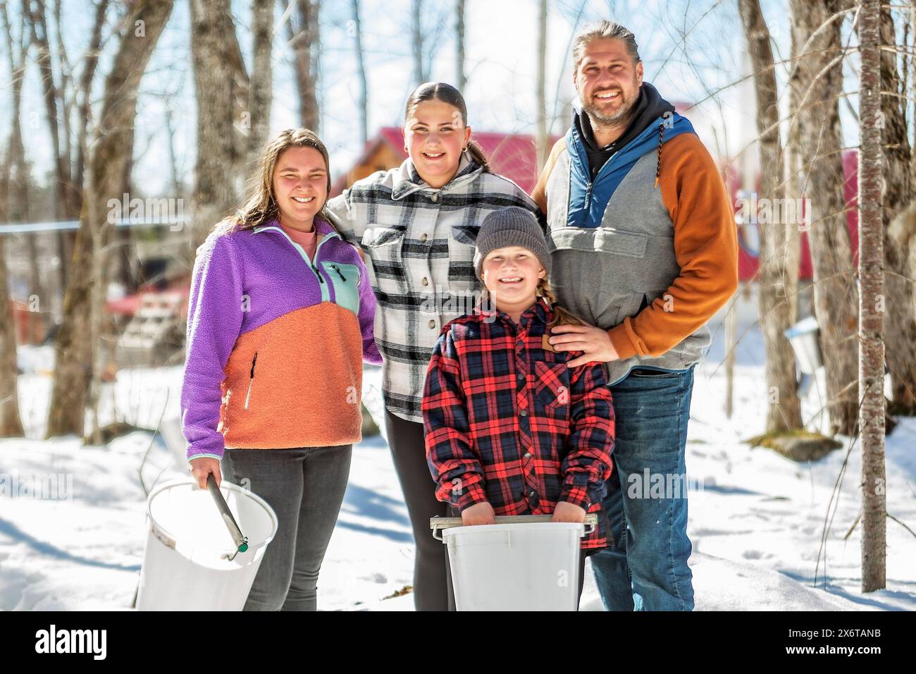 family close to a maple shack having fun together Stock Photo - Alamy