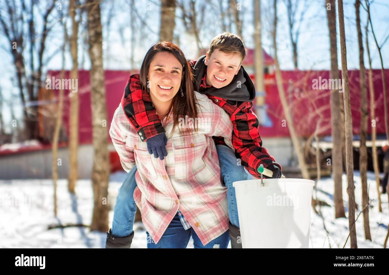 family close to a maple shack having fun together Stock Photo - Alamy